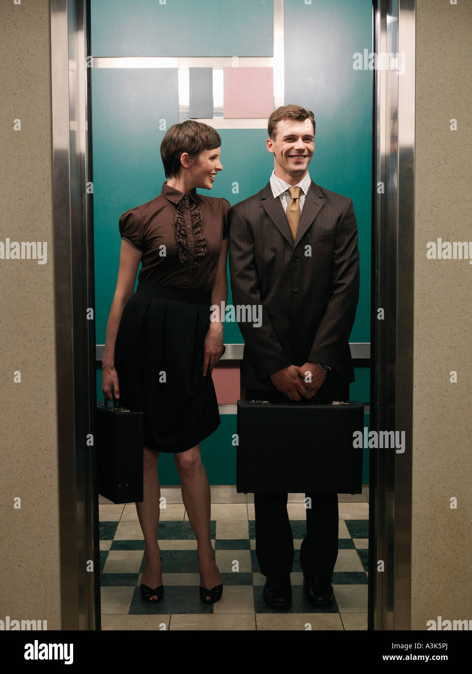 Two businessmen in elevator High Resolution Stock Photography and ...