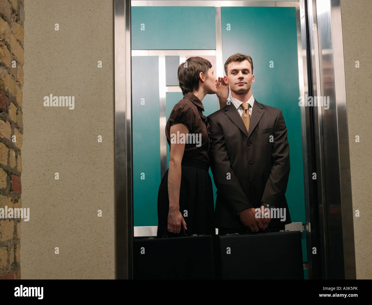 Two businessmen in elevator High Resolution Stock Photography and ...