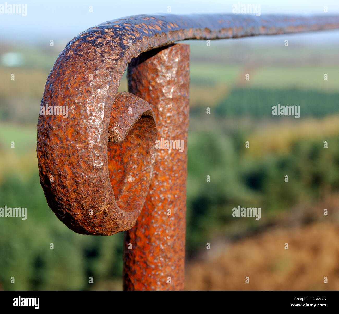 Close up macro of rusty and pitted metal handrail at the top of ...
