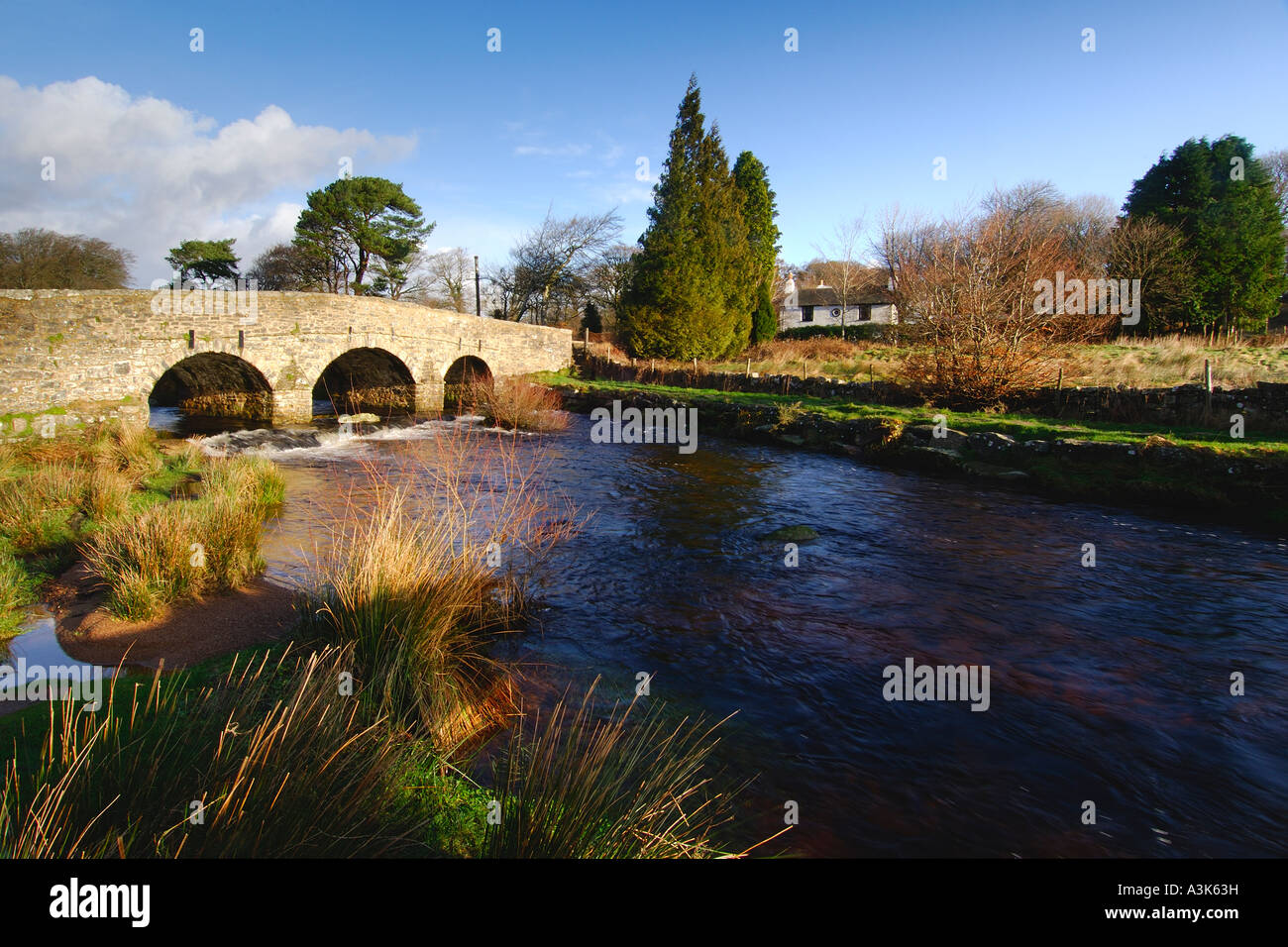 Village of Postbridge Dartmoor showing newer stone road bridge crossing ...