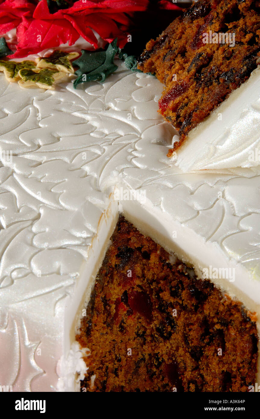Beautifully decorated iced Christmas fruit cake with embossed holly ...