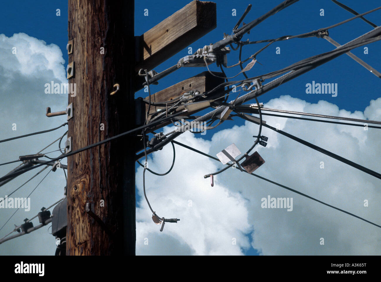 Cable connection broken at top of utility pole Stock Photo - Alamy