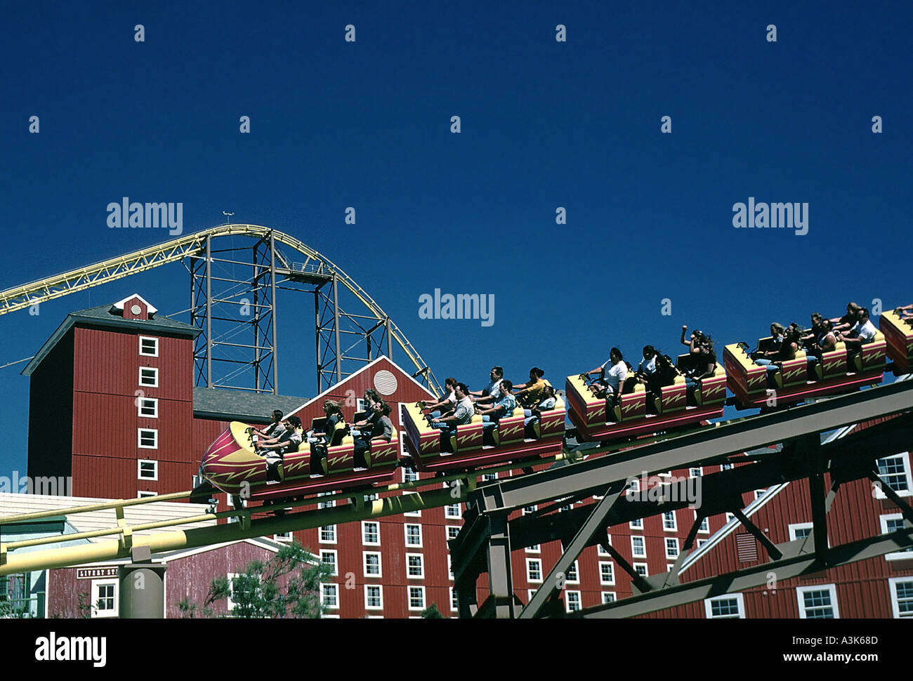 Fast train on the track people enjoying a roller coaster ride Stock ...