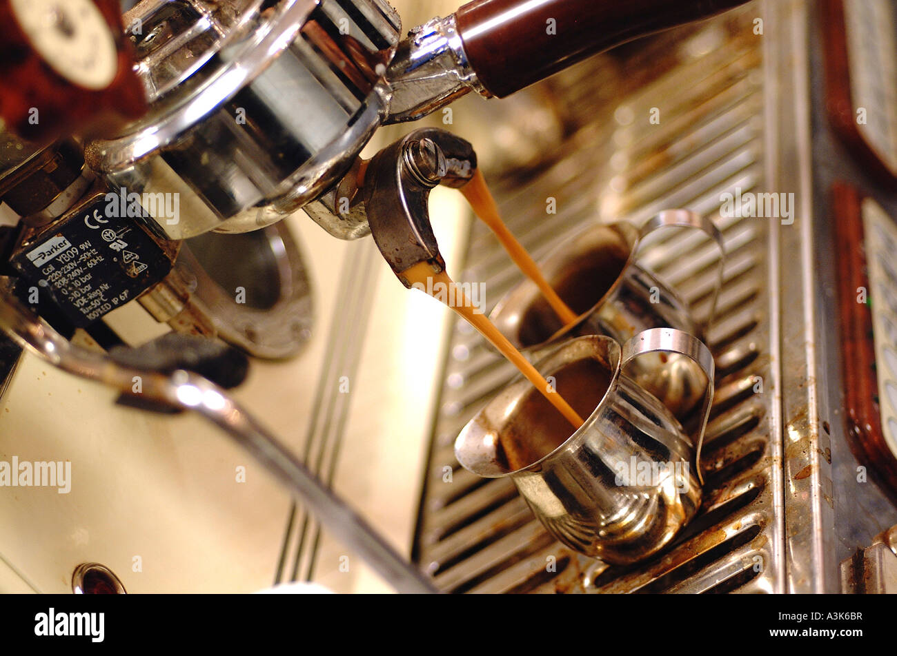 Fresh coffee pouring from an espresso machine Stock Photo - Alamy
