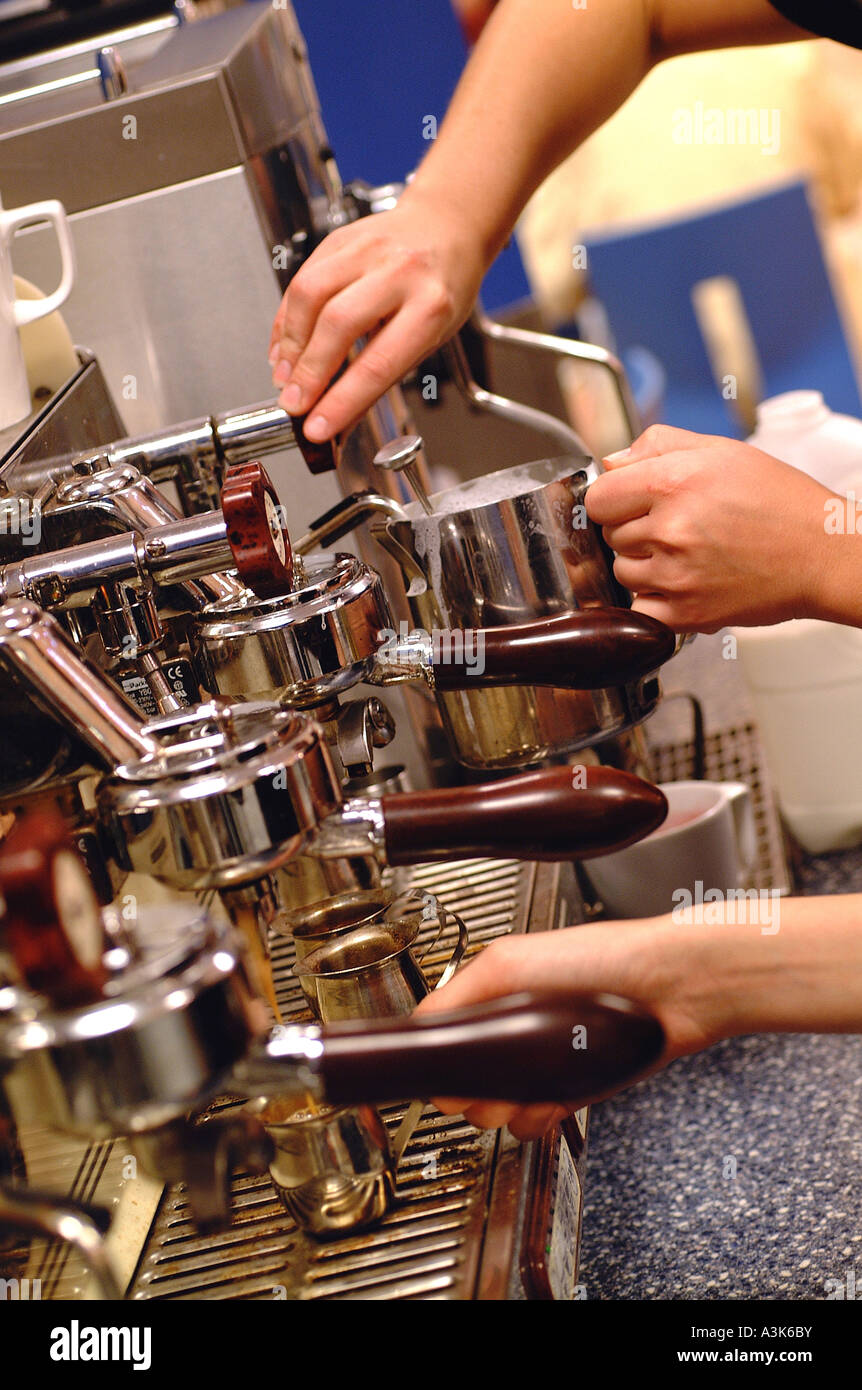Commercial espresso machine in use in a busy coffee bar Stock Photo - Alamy