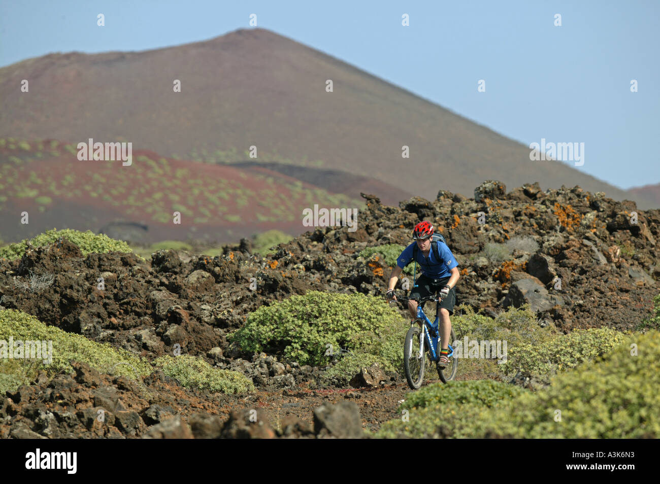 A Mountain Biker riding in a Rugged Landscape Stock Photo - Alamy