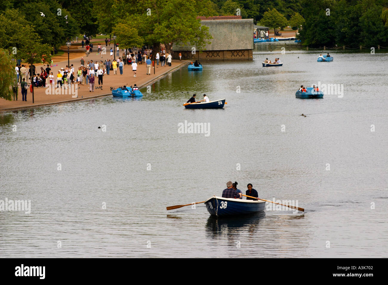 couple in a rowing boat on the Serpentine in Hyde Park in london ...