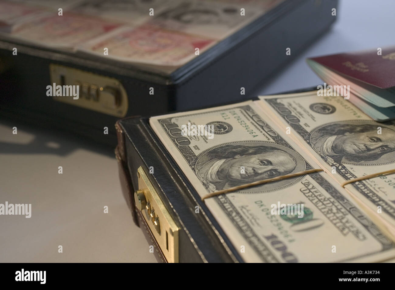 Closeup of dollar bills in briefcase with passport sterling briefcase ...