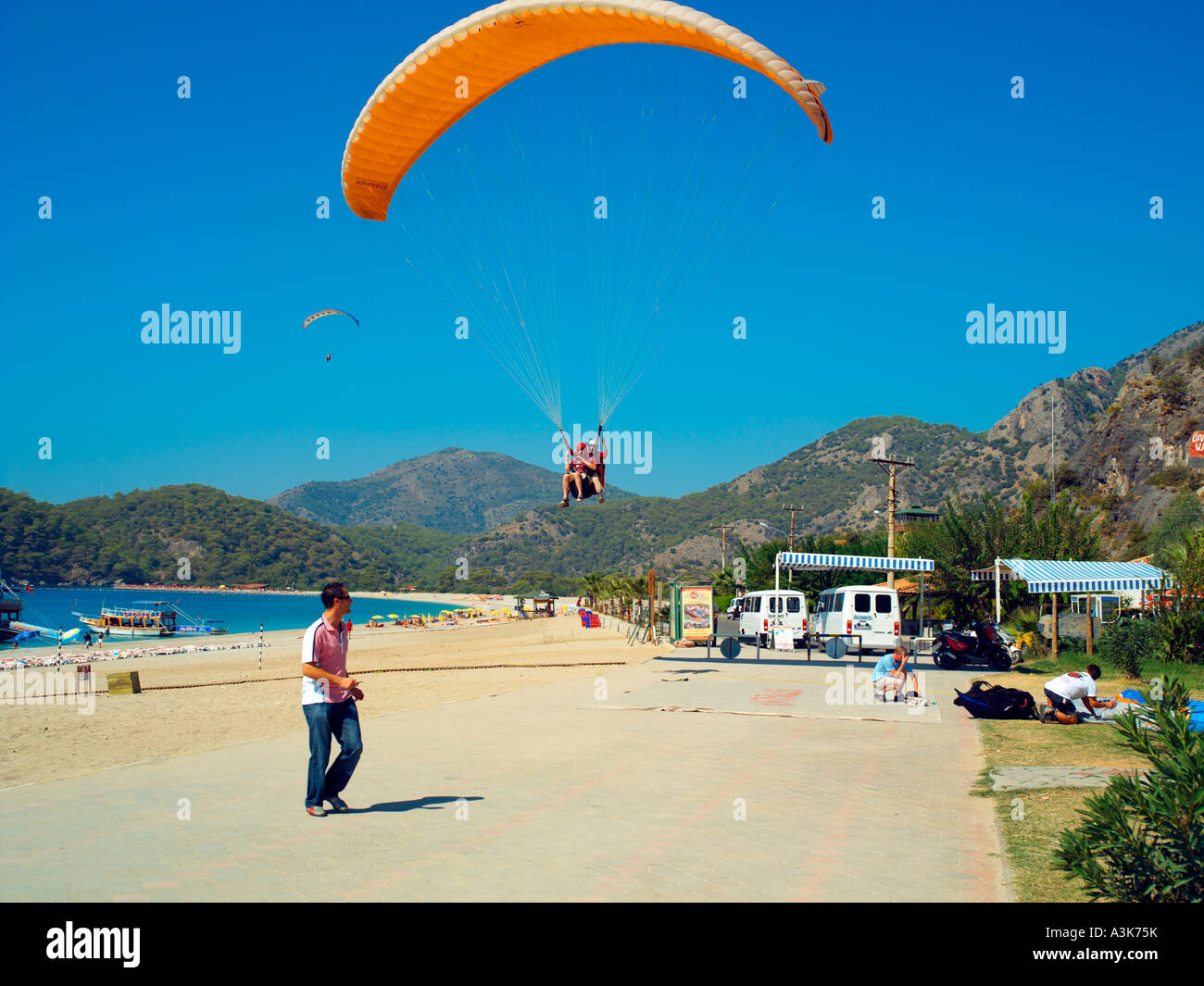 Paragliders landing on the beach at Oludeniz Stock Photo - Alamy