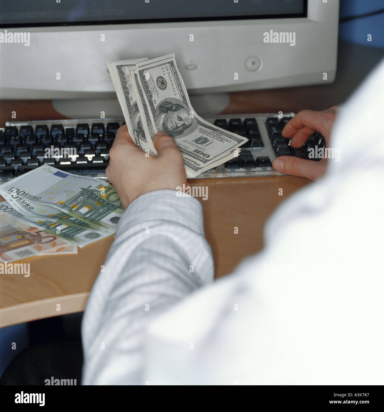 Back office cashier counting out banknotes Stock Photo - Alamy