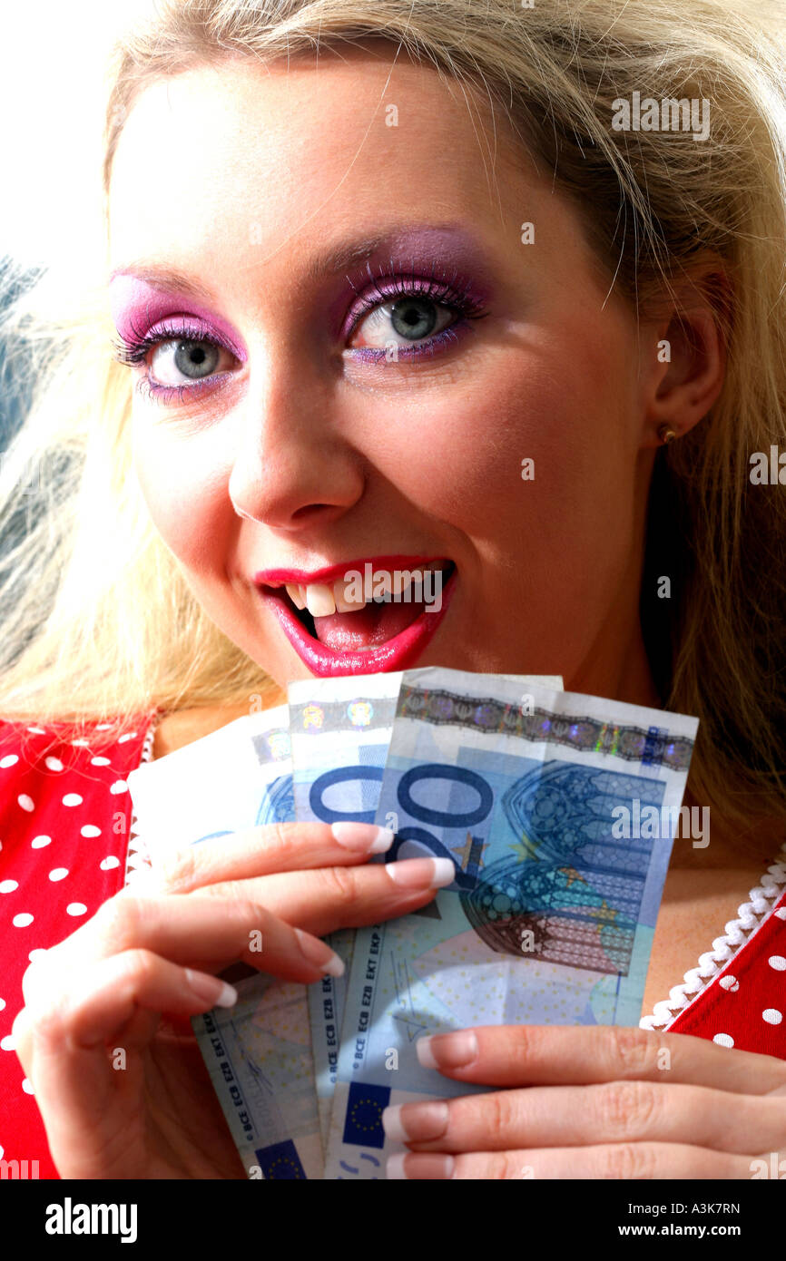Young Woman Holding Fan of Cash Model Released Stock Photo - Alamy