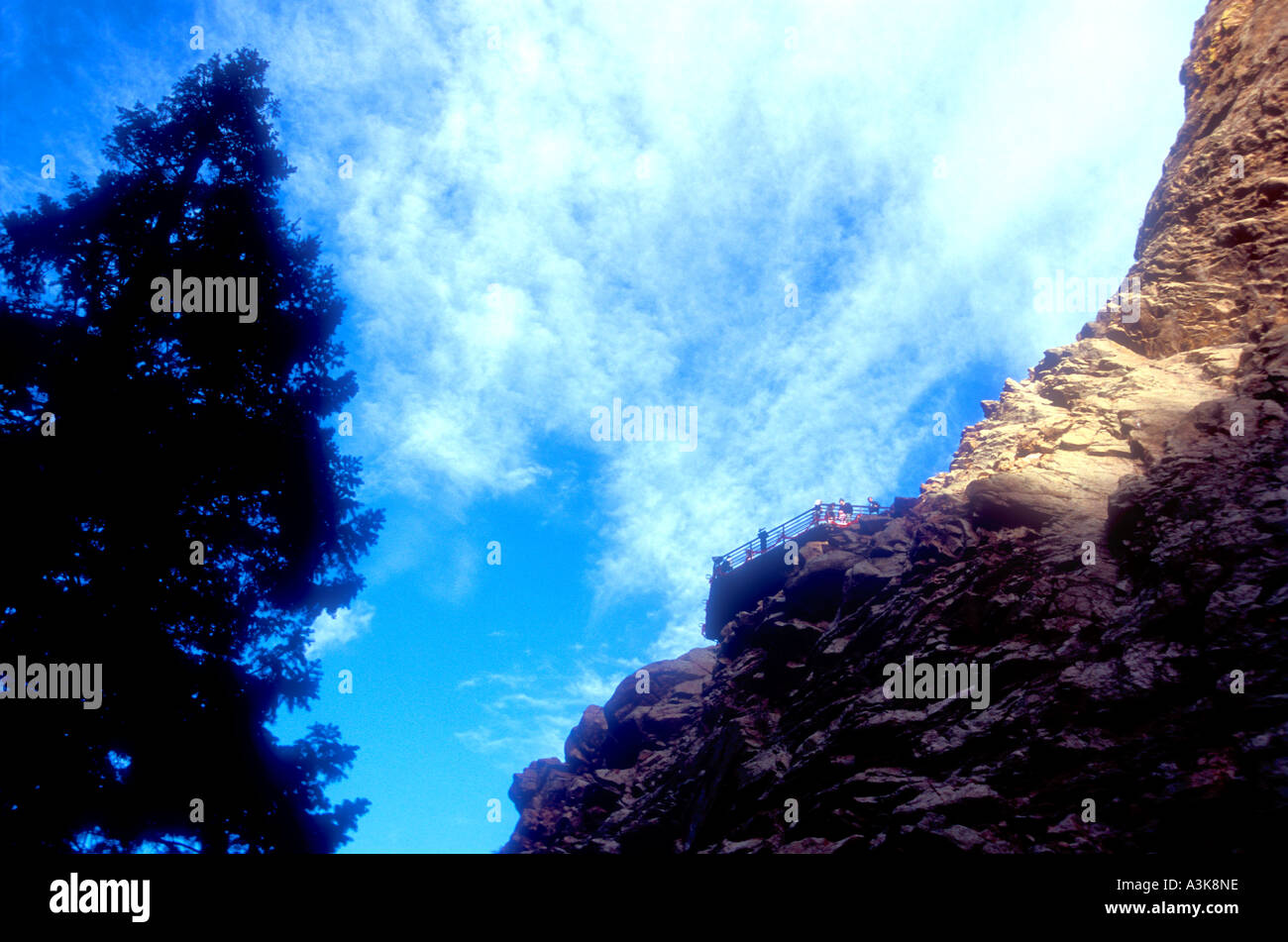 Silhouetted cliff and scenic overlook deck on a hillside in the ...