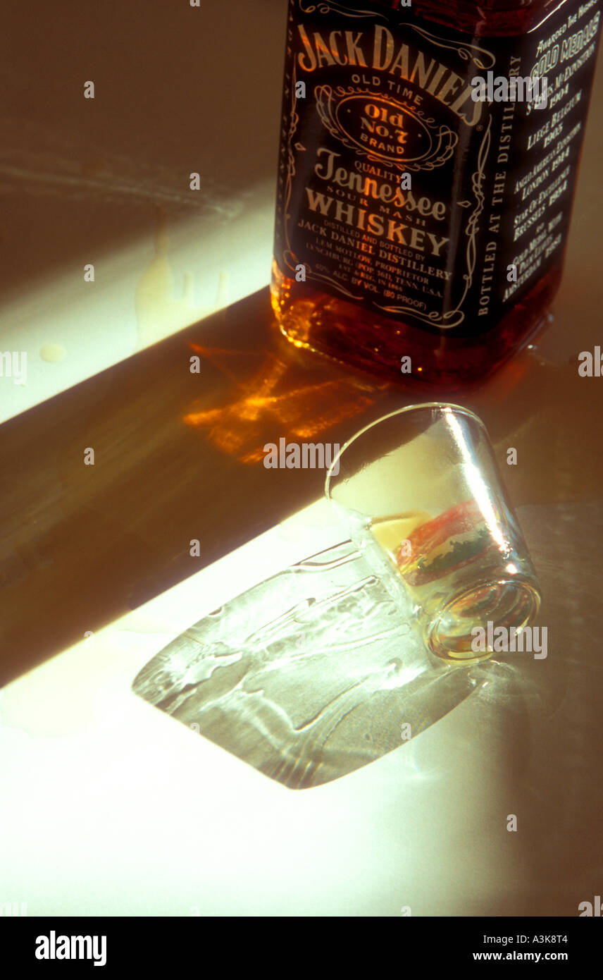 Jack Daniels whiskey bourbon and spilled shot glass Stock Photo - Alamy