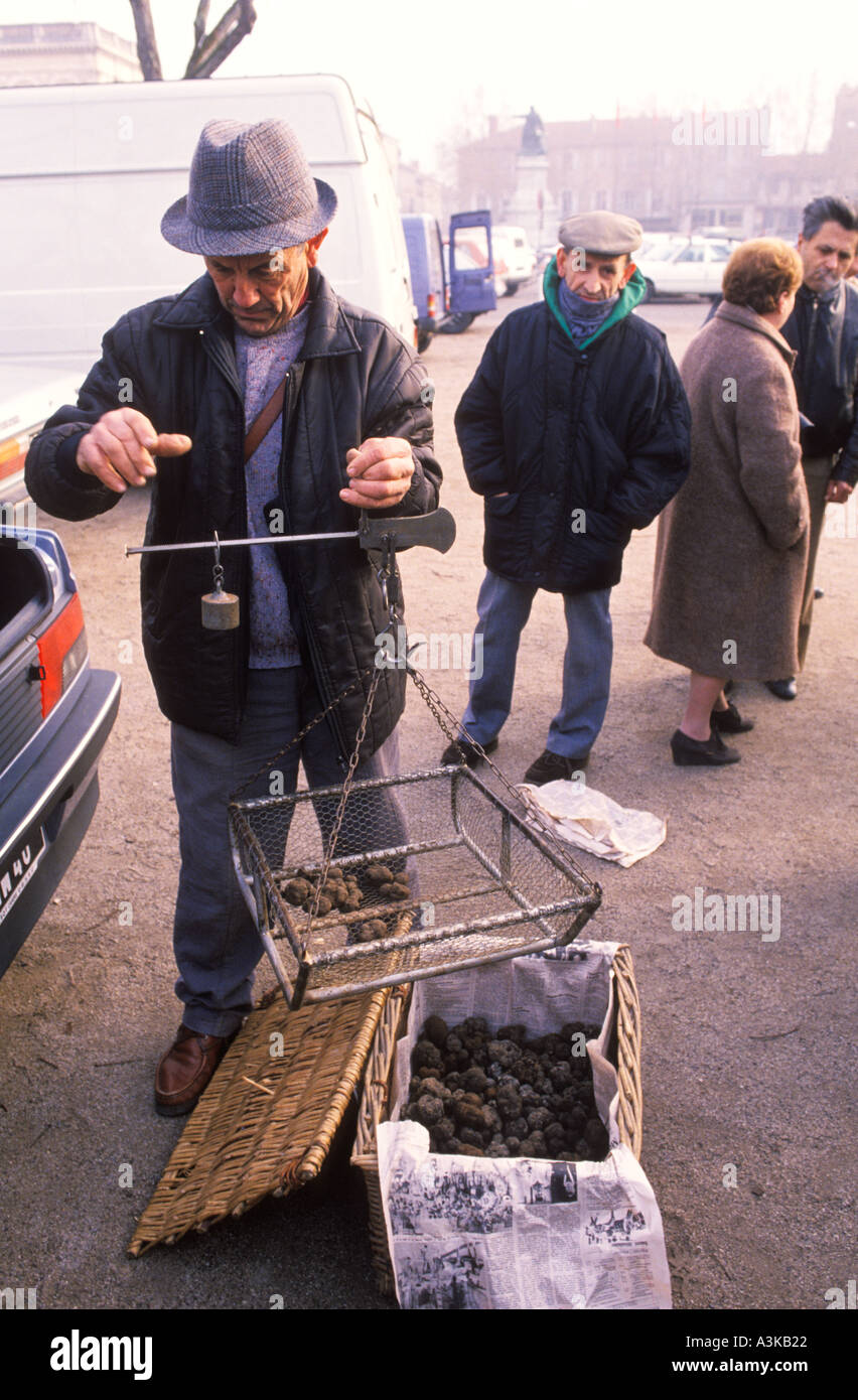 Truffle market Cahors France. Man weighing out and selling truffles by ...