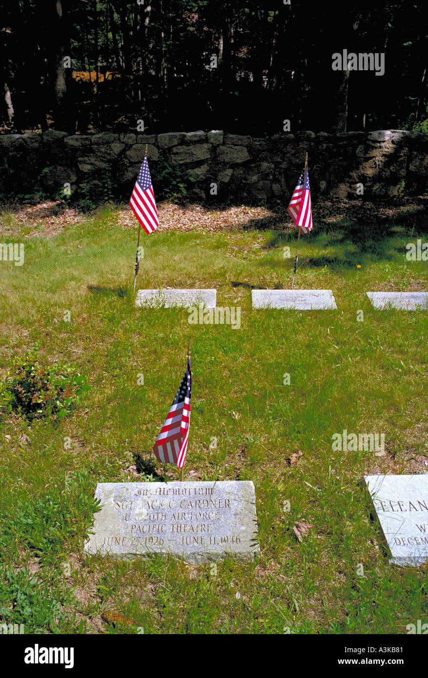 In a little cemetery near Monument Beach on Cape Cod national flags fly ...