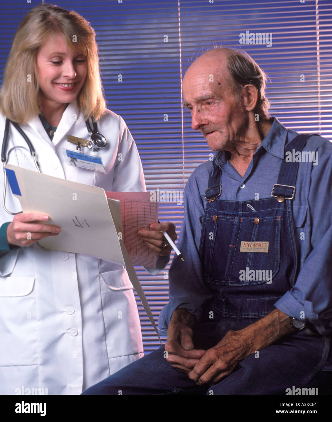 a very old man with his female doctor Stock Photo - Alamy