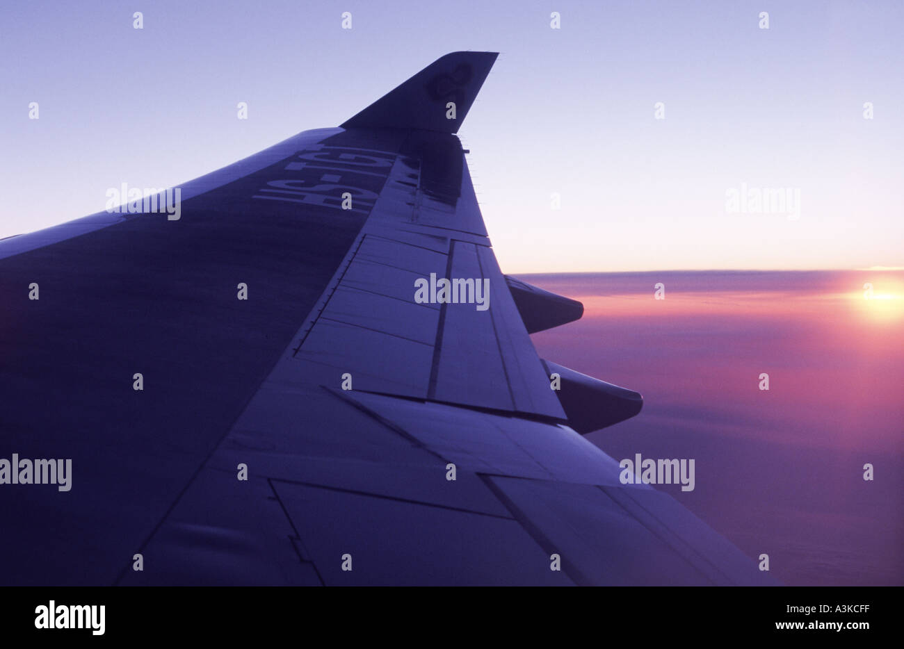 Sunrise through plane window Stock Photo - Alamy