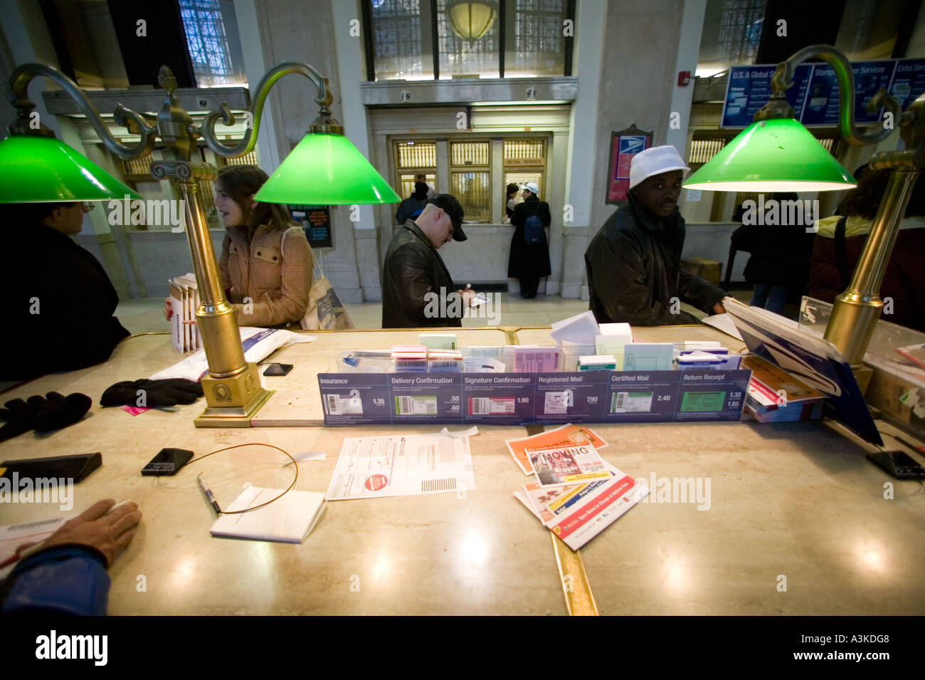 People wait in line at the James A Farley Post Office building on 8th ...