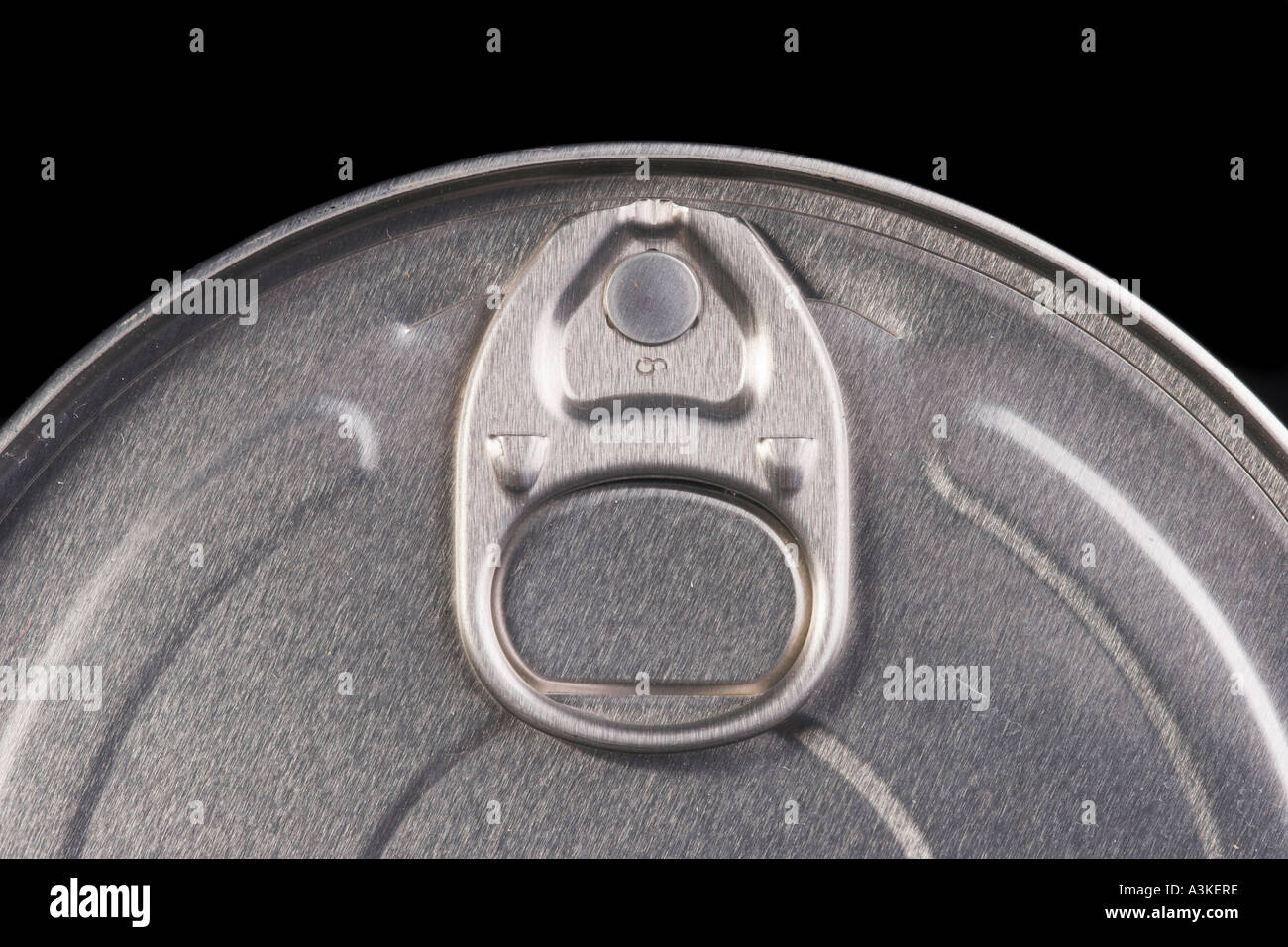 Ring pull of a tin can, studio, isolated on black Stock Photo - Alamy