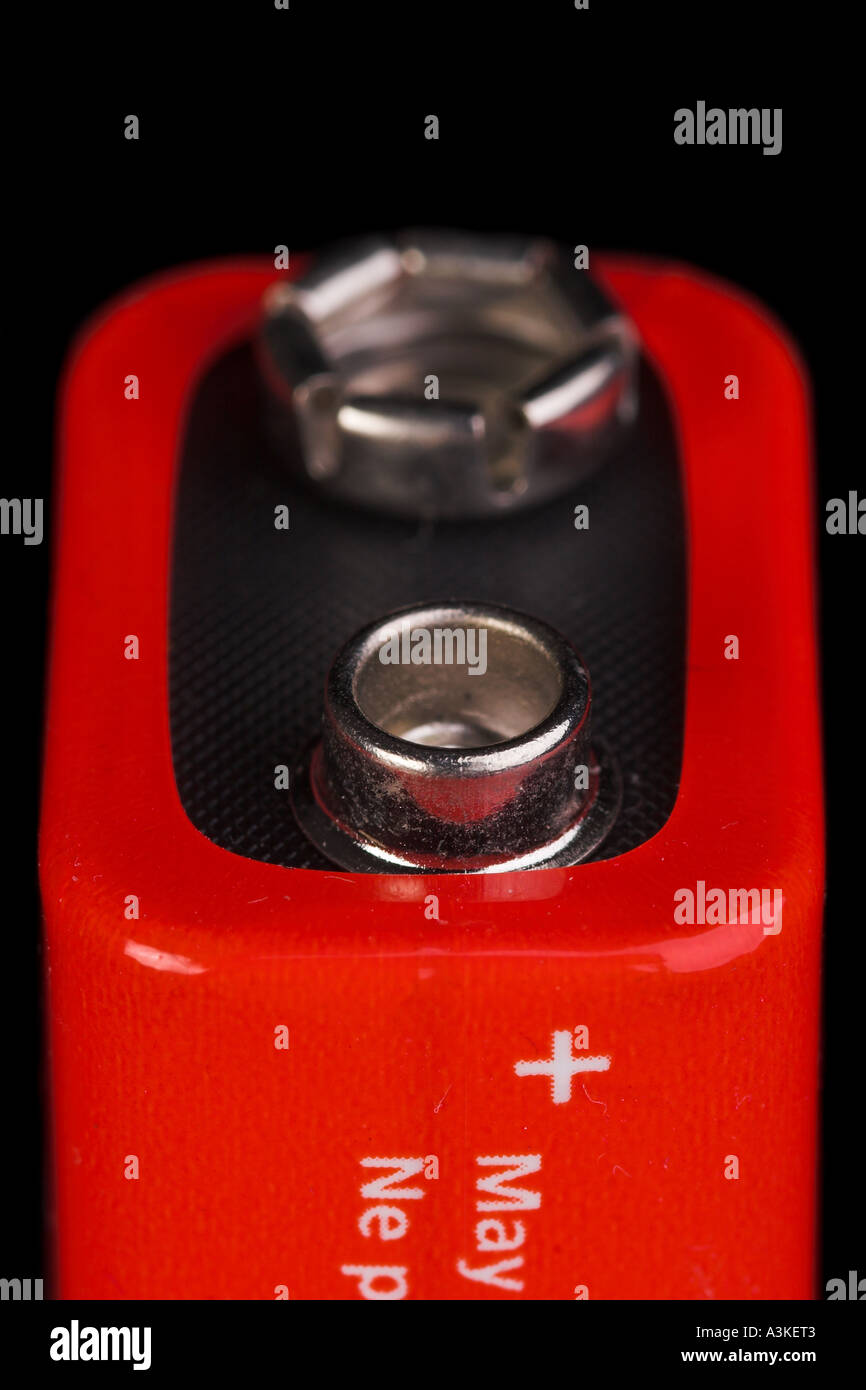 Battery, plus-pole, studio-shot, isolated on black Stock Photo - Alamy