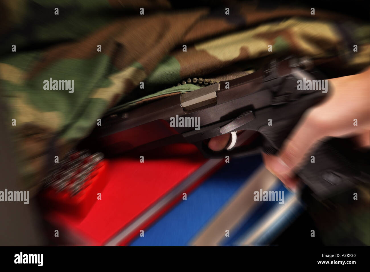 Gun in backpack Stock Photo - Alamy