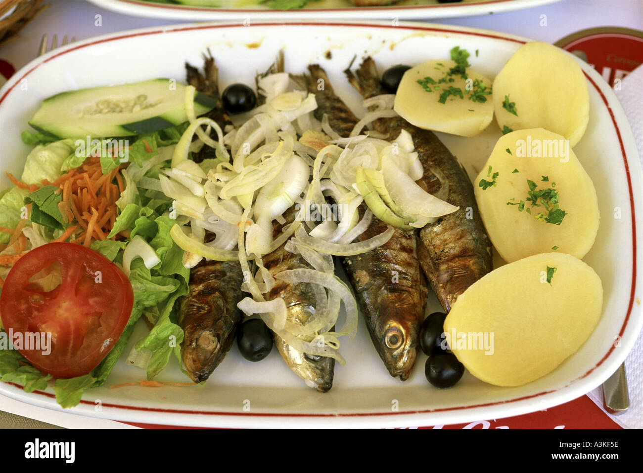 Grilled sardine fish plate Stock Photo - Alamy