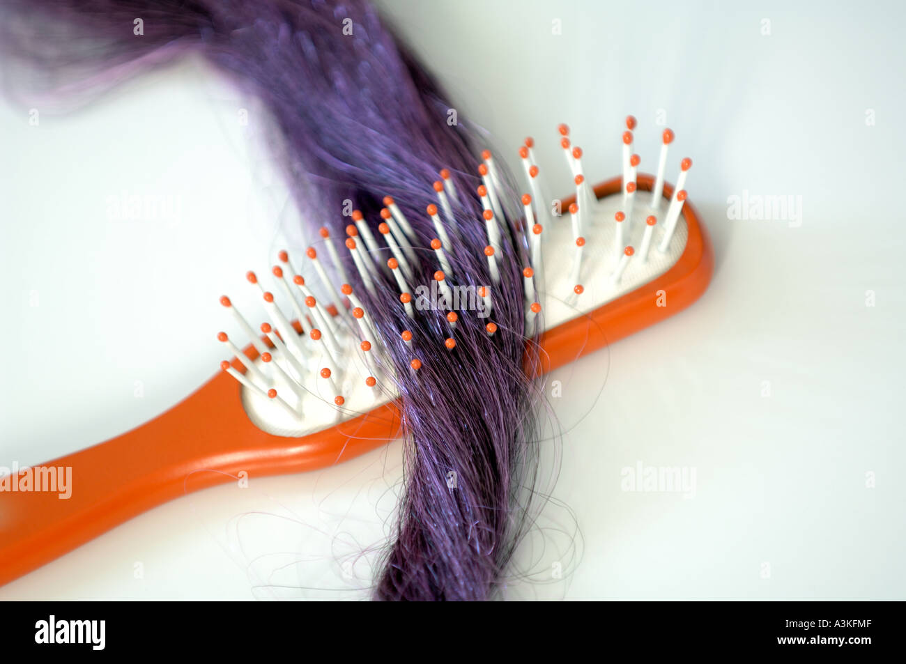 Fake blue hair on hairbrush Stock Photo - Alamy