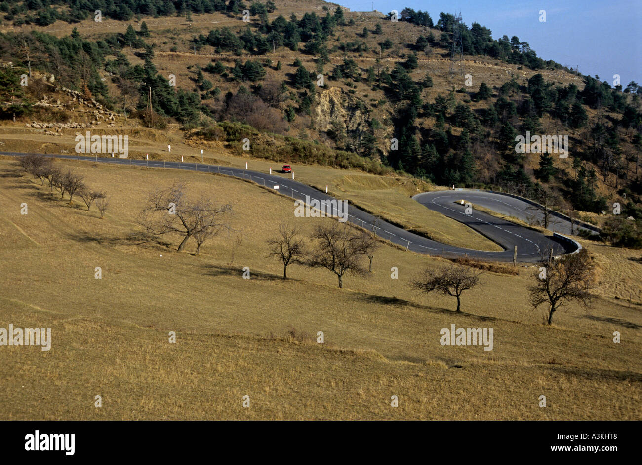 Curved road meandering through a hillside, Tende Pass, France Stock ...