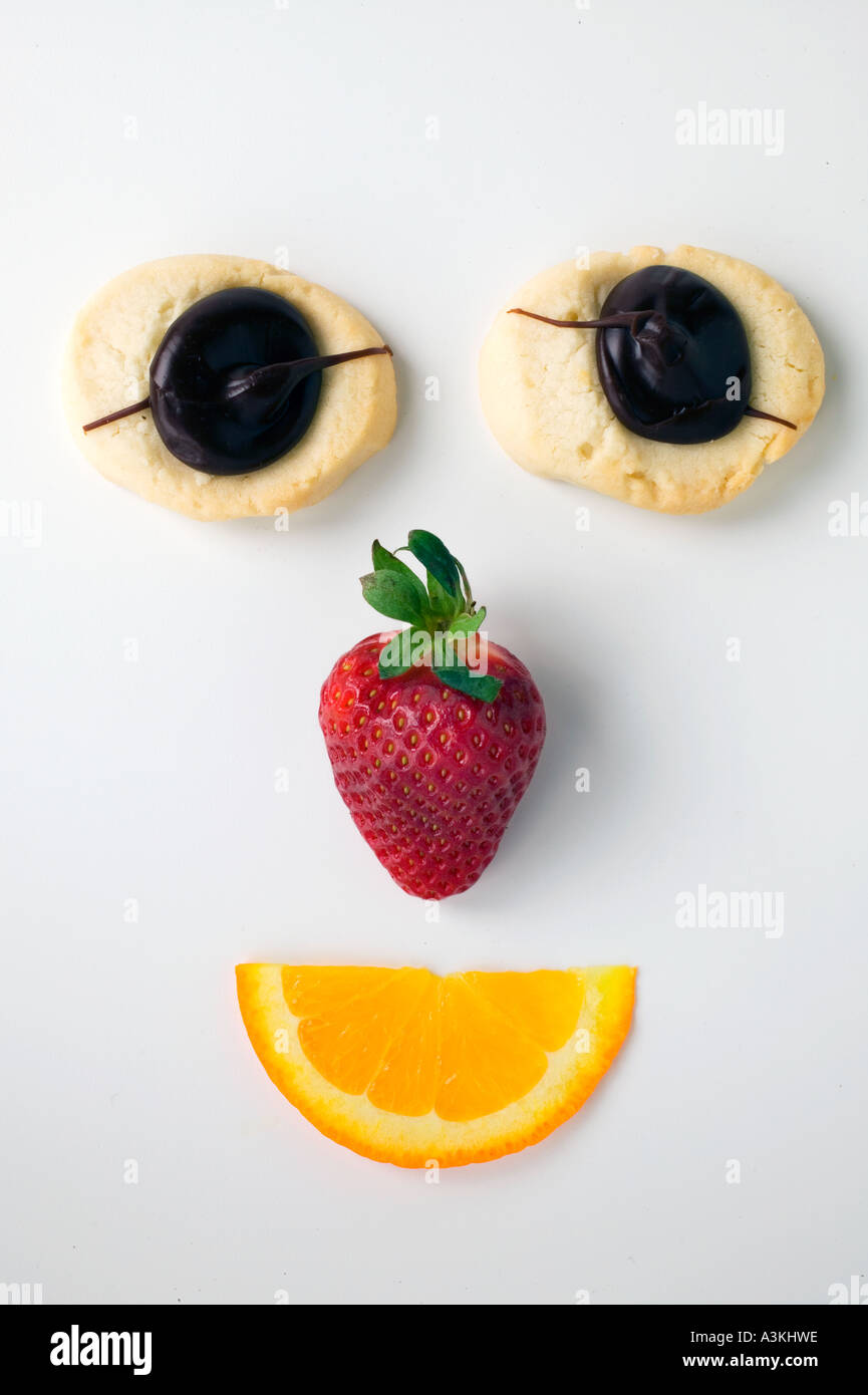 Food face cookie eyes orange strawberry eyes eat Stock Photo - Alamy