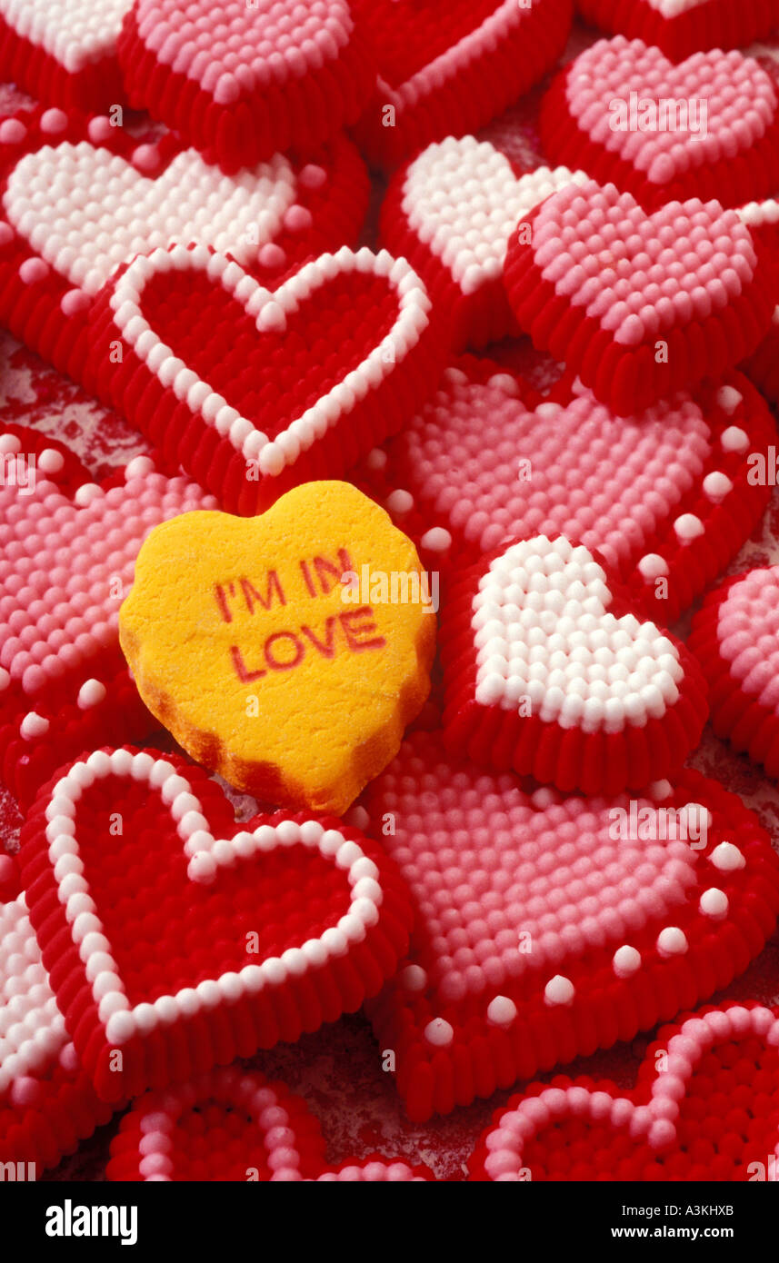 Pile of heart shaped candy with I m in love note Stock Photo - Alamy