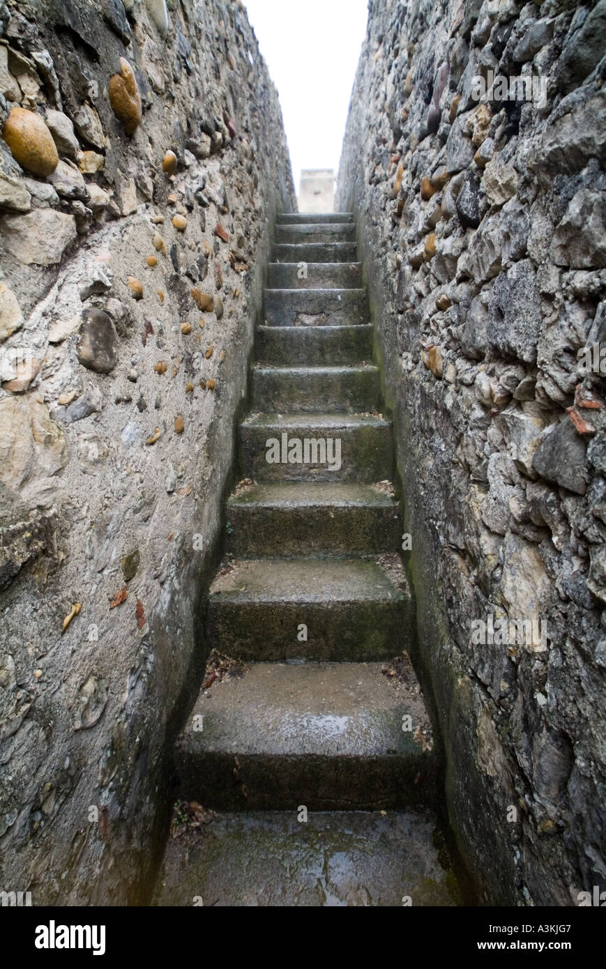 Narrow steps between old stone walls at the Adhemar Castle in ...