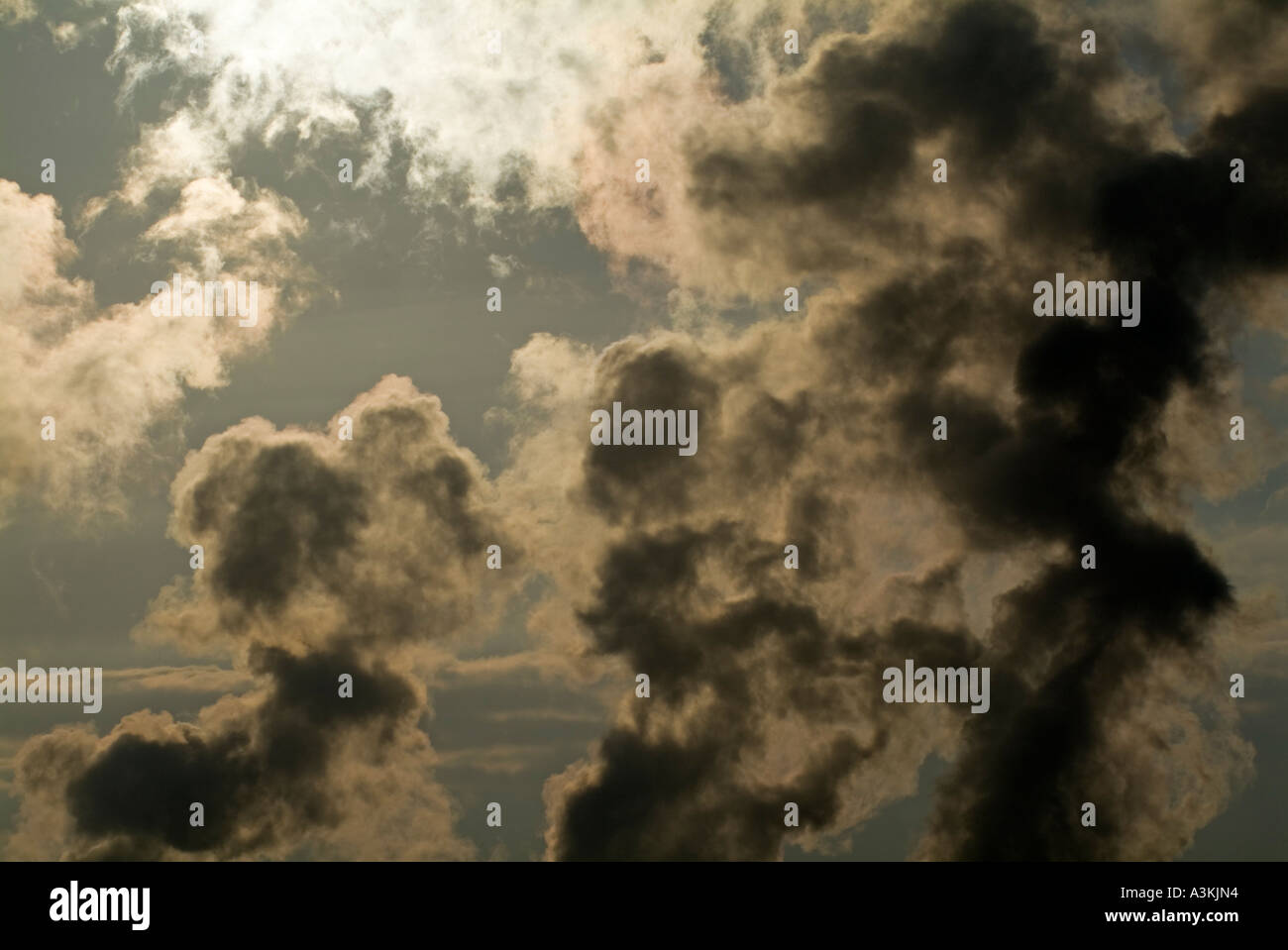 Thick smoke billowing upwards Stock Photo - Alamy