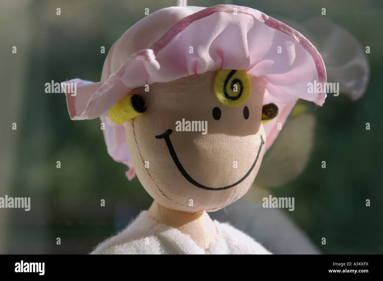 Happy doll in window January 2007 Stock Photo - Alamy