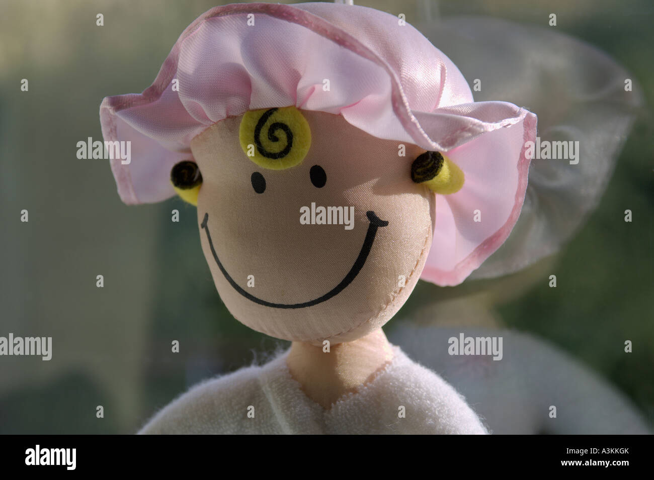 Happy doll in window January 2007 Stock Photo - Alamy