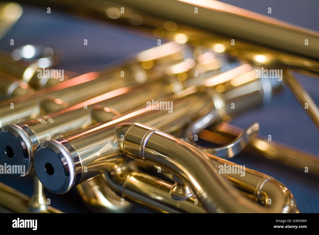 Three musical keys on a shiny trumpet Stock Photo - Alamy