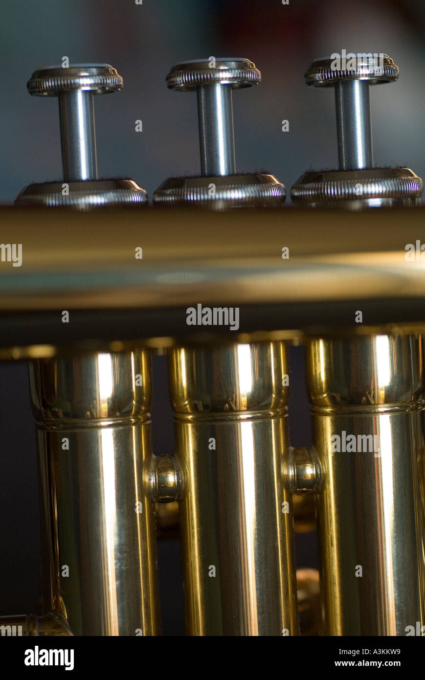 Three musical keys on a shiny trumpet Stock Photo - Alamy
