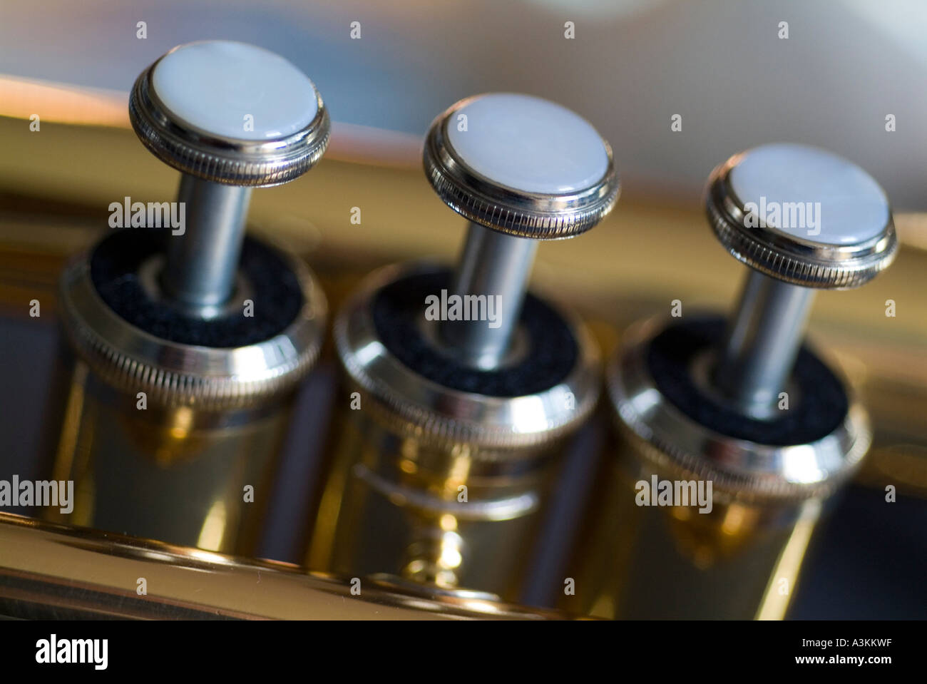 Three musical keys on a shiny trumpet Stock Photo - Alamy