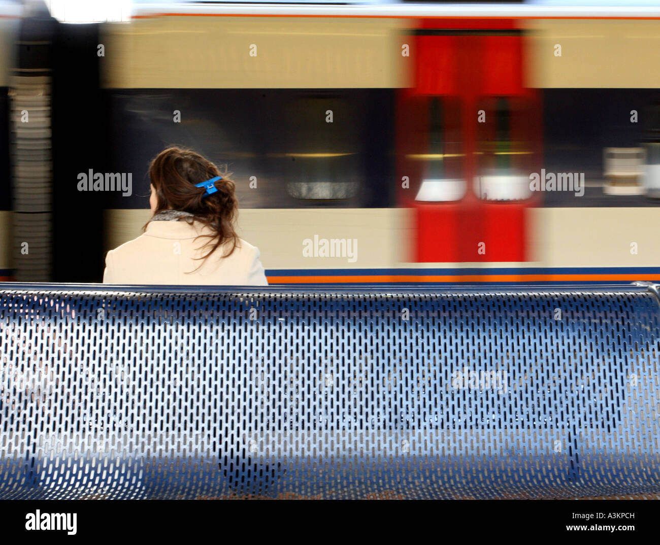 Train goes past woman hi-res stock photography and images - Alamy