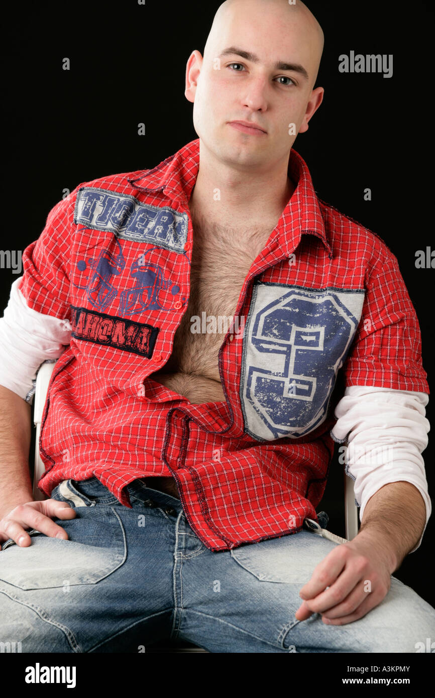 Young man posing with shirt open Stock Photo - Alamy