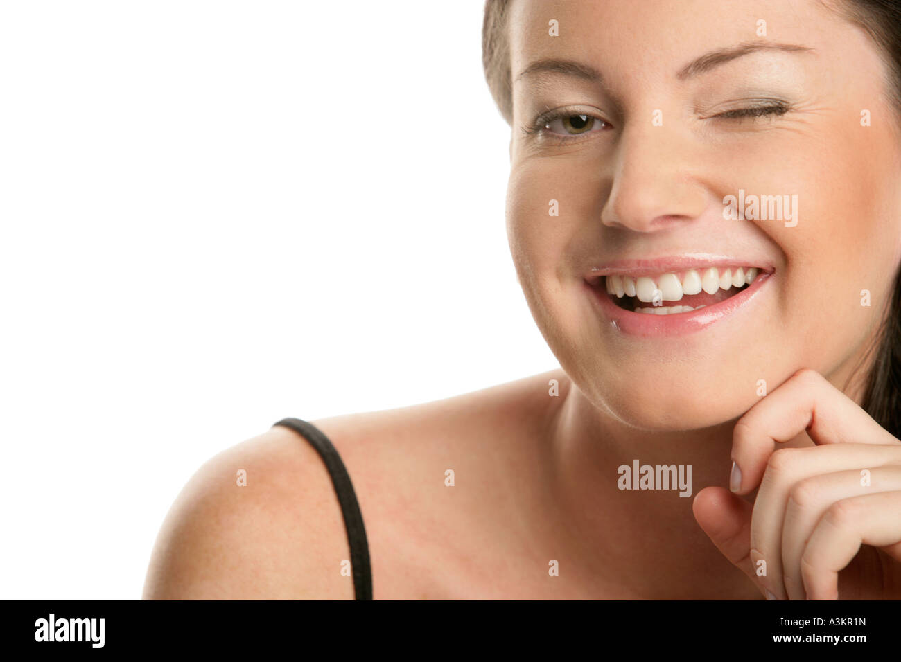 Young woman winking Stock Photo - Alamy