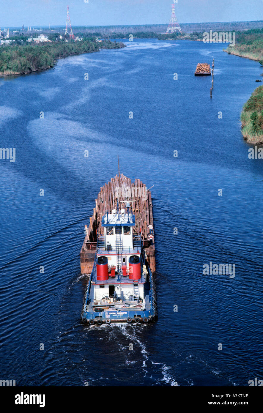 Tug and pulpwood load on barge Mobile AL USA Stock Photo - Alamy