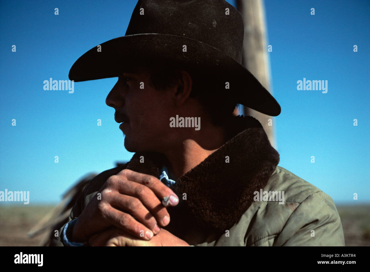 Cowboy smoking cigarette hi-res stock photography and images - Alamy