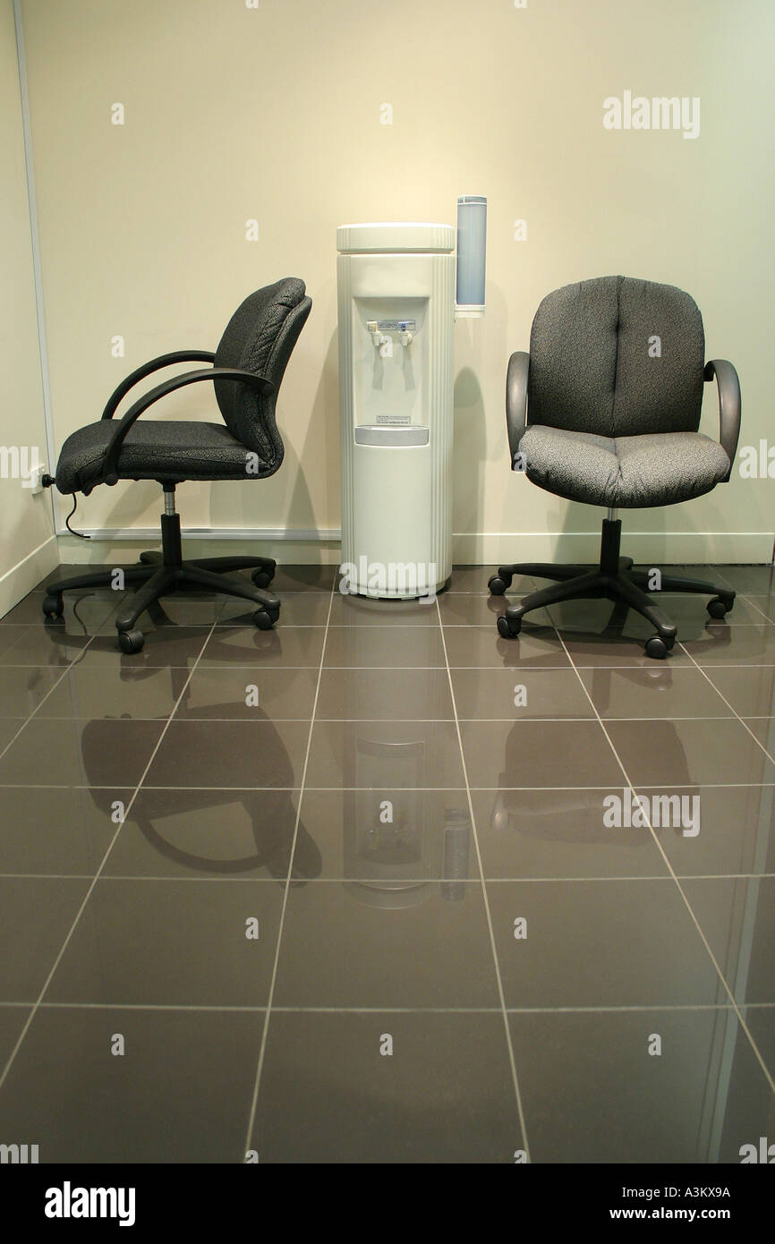 Chairs by the Water Cooler Stock Photo - Alamy