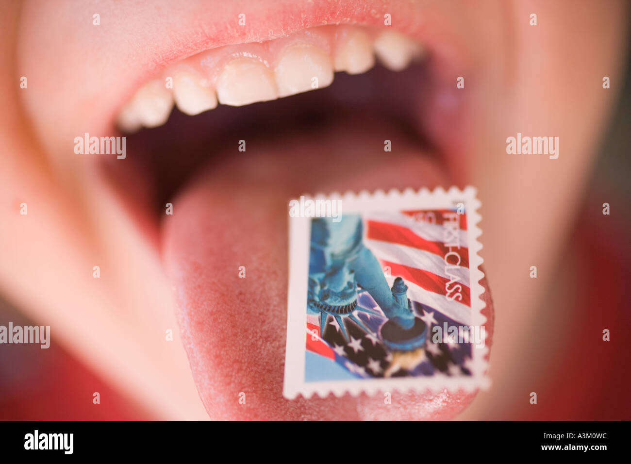 Licking stamp hi-res stock photography and images - Alamy