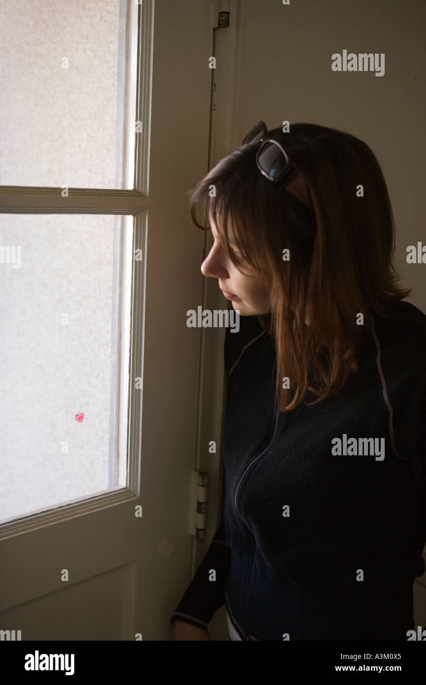 Woman peek door hi-res stock photography and images - Alamy