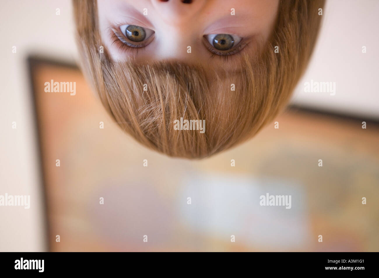 portrait of child upside down Stock Photo - Alamy