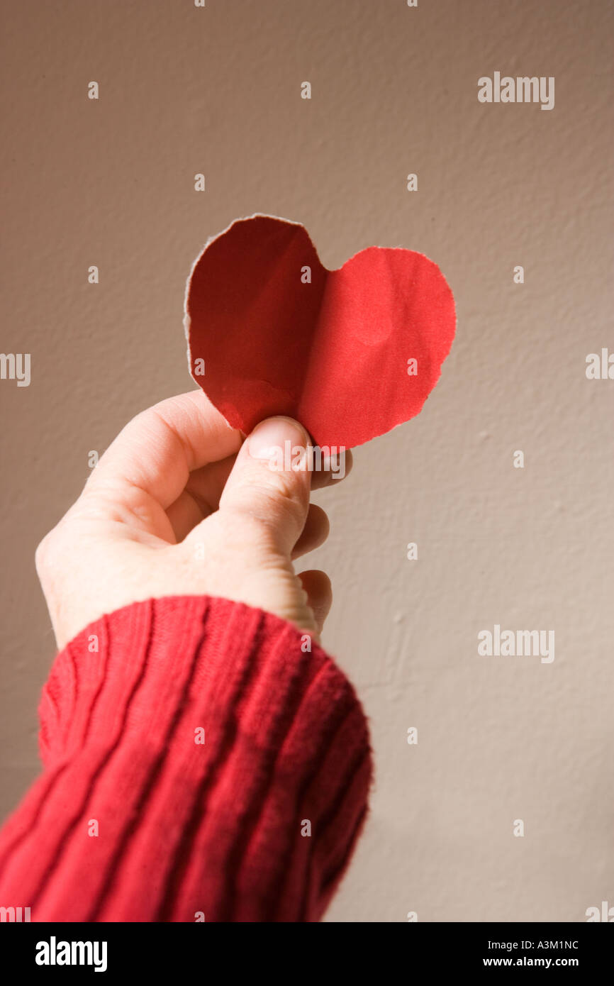 hand holding paper heart Stock Photo - Alamy
