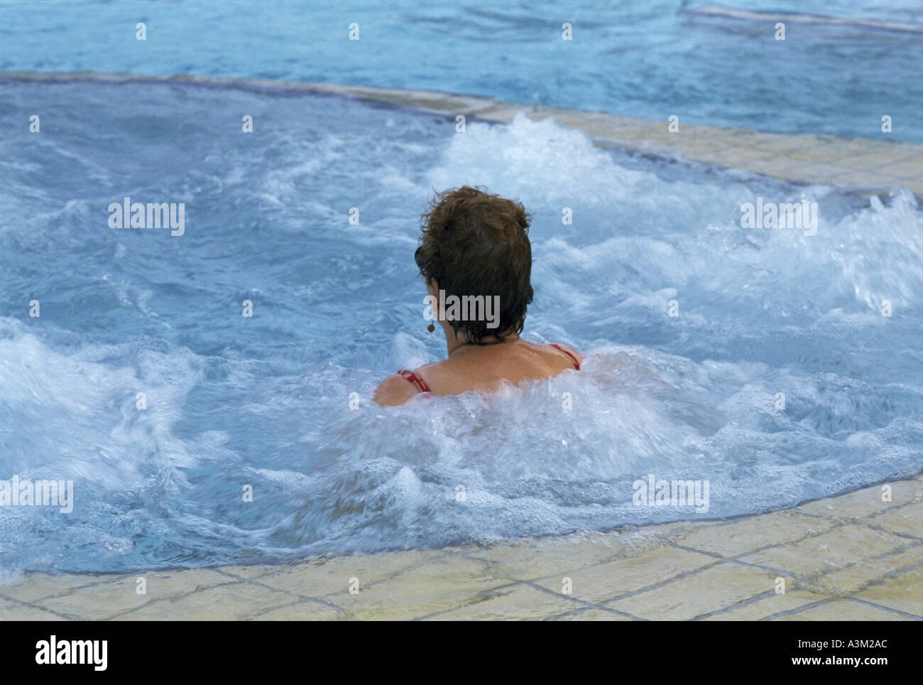 Woman facing away pool hi-res stock photography and images - Alamy