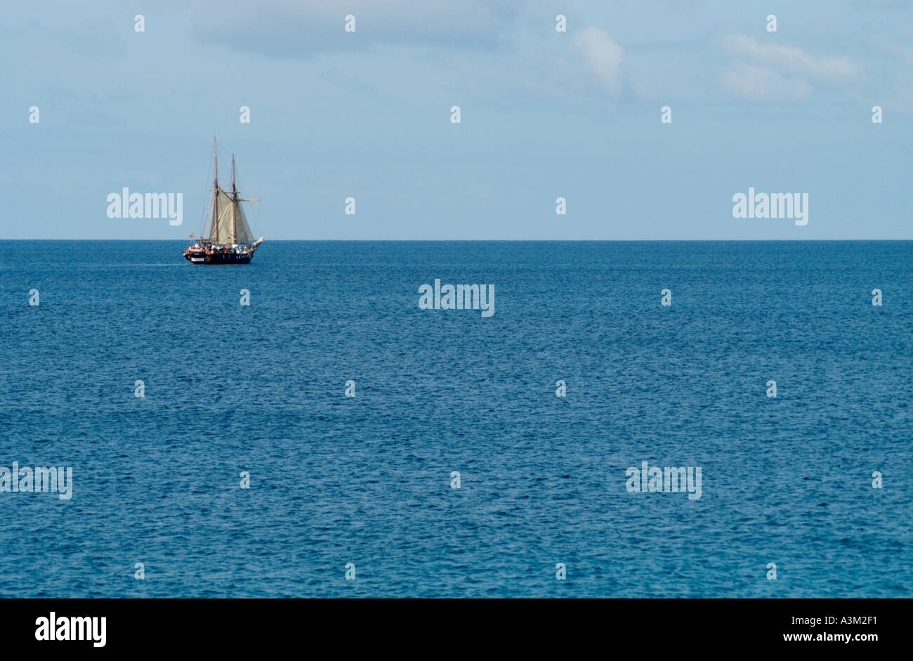 Pirate ship alone on the blue sea Stock Photo - Alamy
