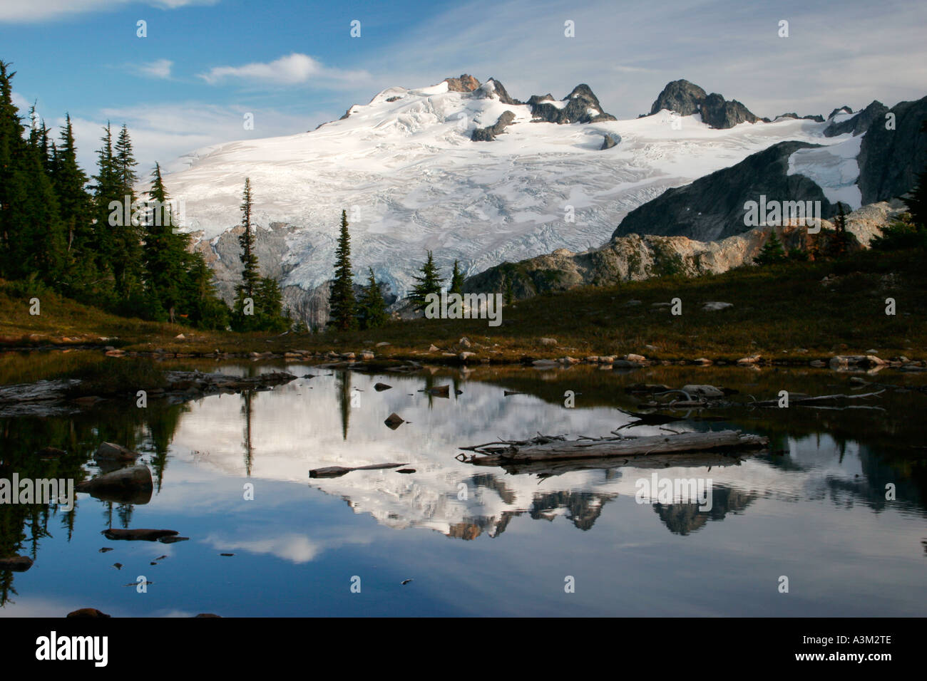 Mt Challenger reflected in a tarn above Whatcom Pass North Cascades ...
